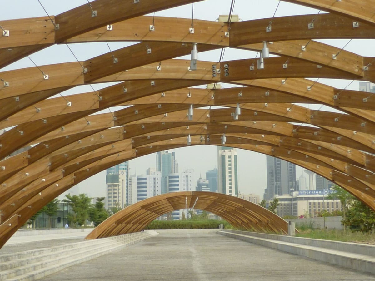 Crossover Glulam arches form diamond pattern colonnade